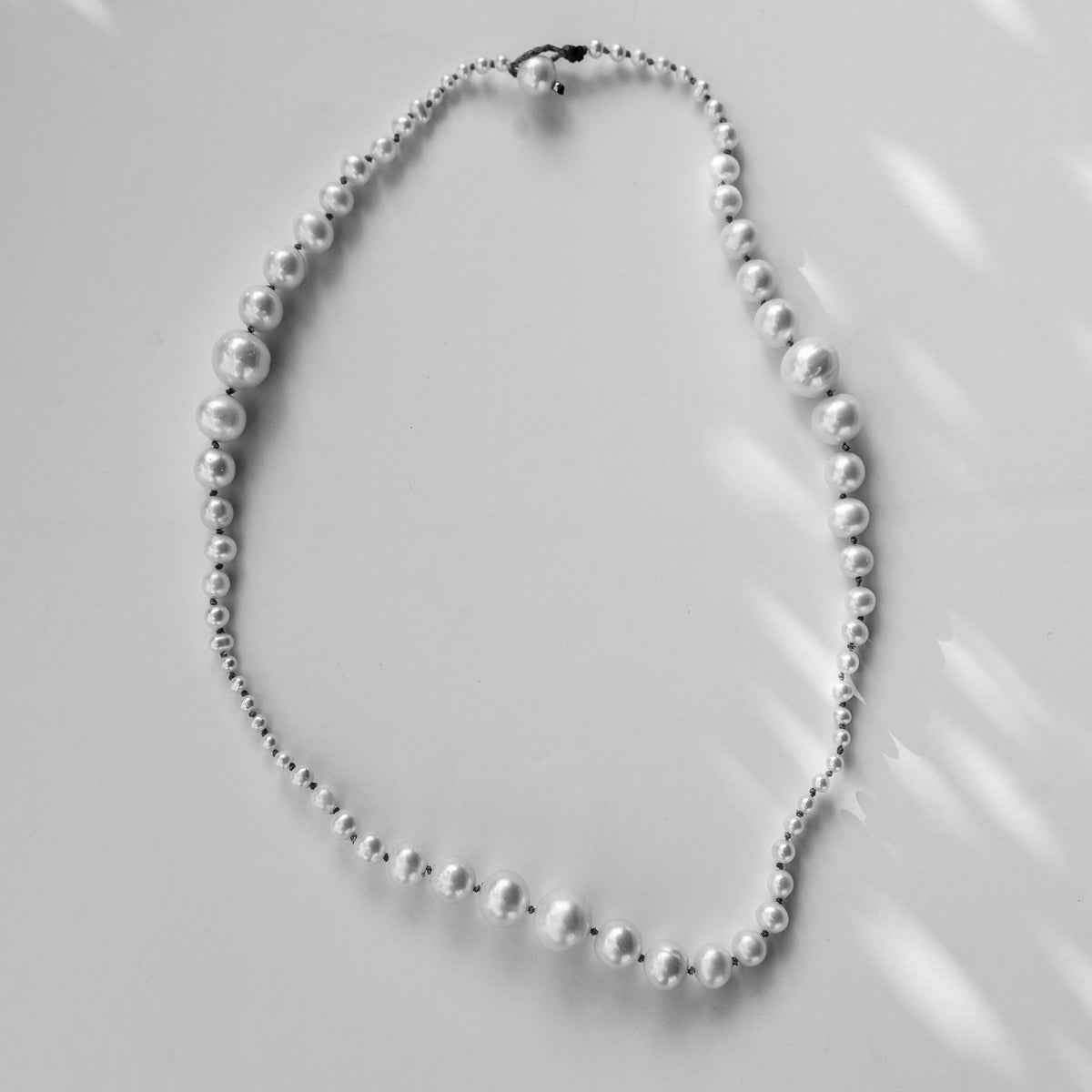 MARICHELLE / PEARL NECKLACE LONG, BLACK CORD – RIKA STUDIOS